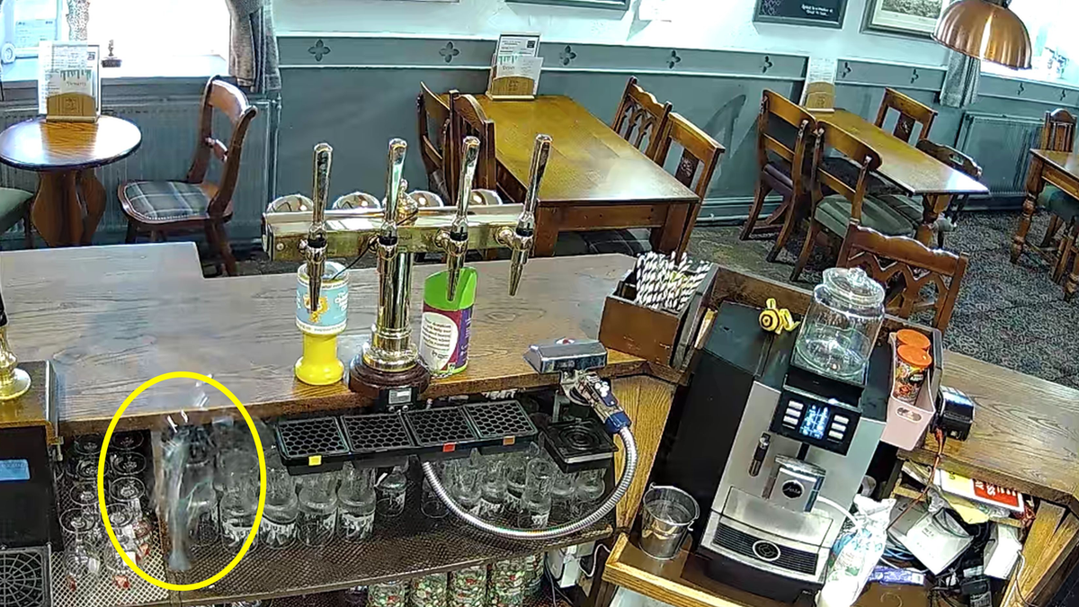 Viral moment 'friendly ghost' haunts pub by 'throwing glasses and ...