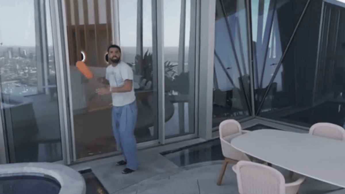 'Truth' behind viral drone footage catching Drake out in penthouse as ...