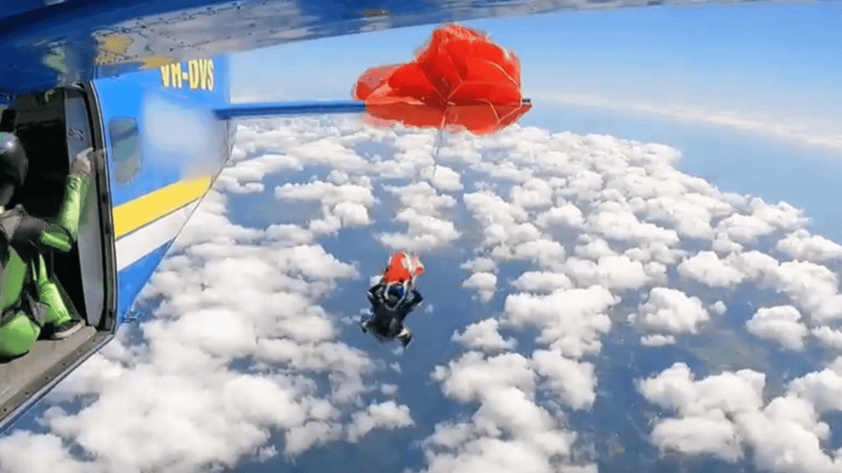 Moment skydive goes horribly wrong as parachute gets caught on plane's tail
